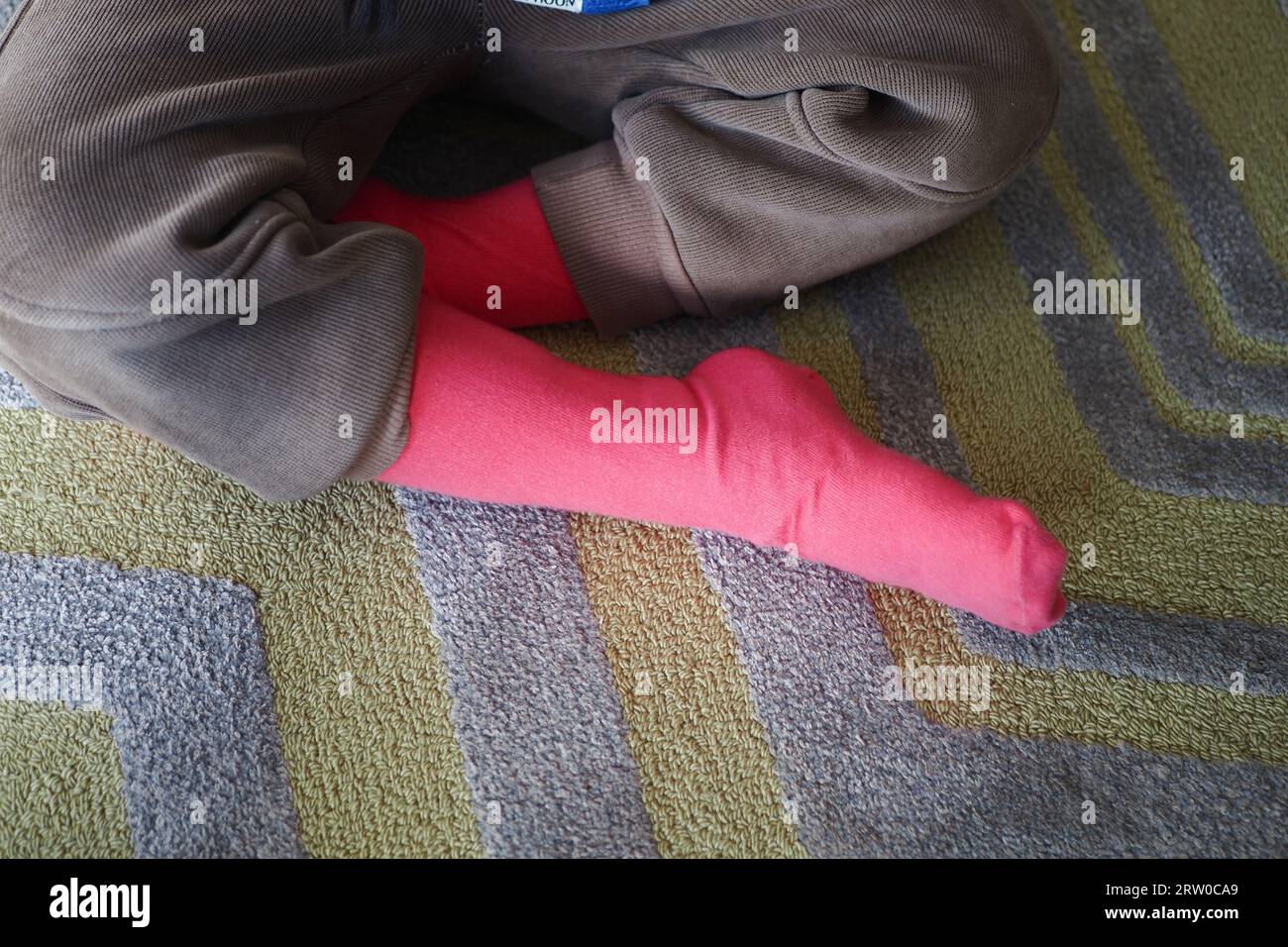 a colorful soft socks on child feet Stock Photo - Alamy