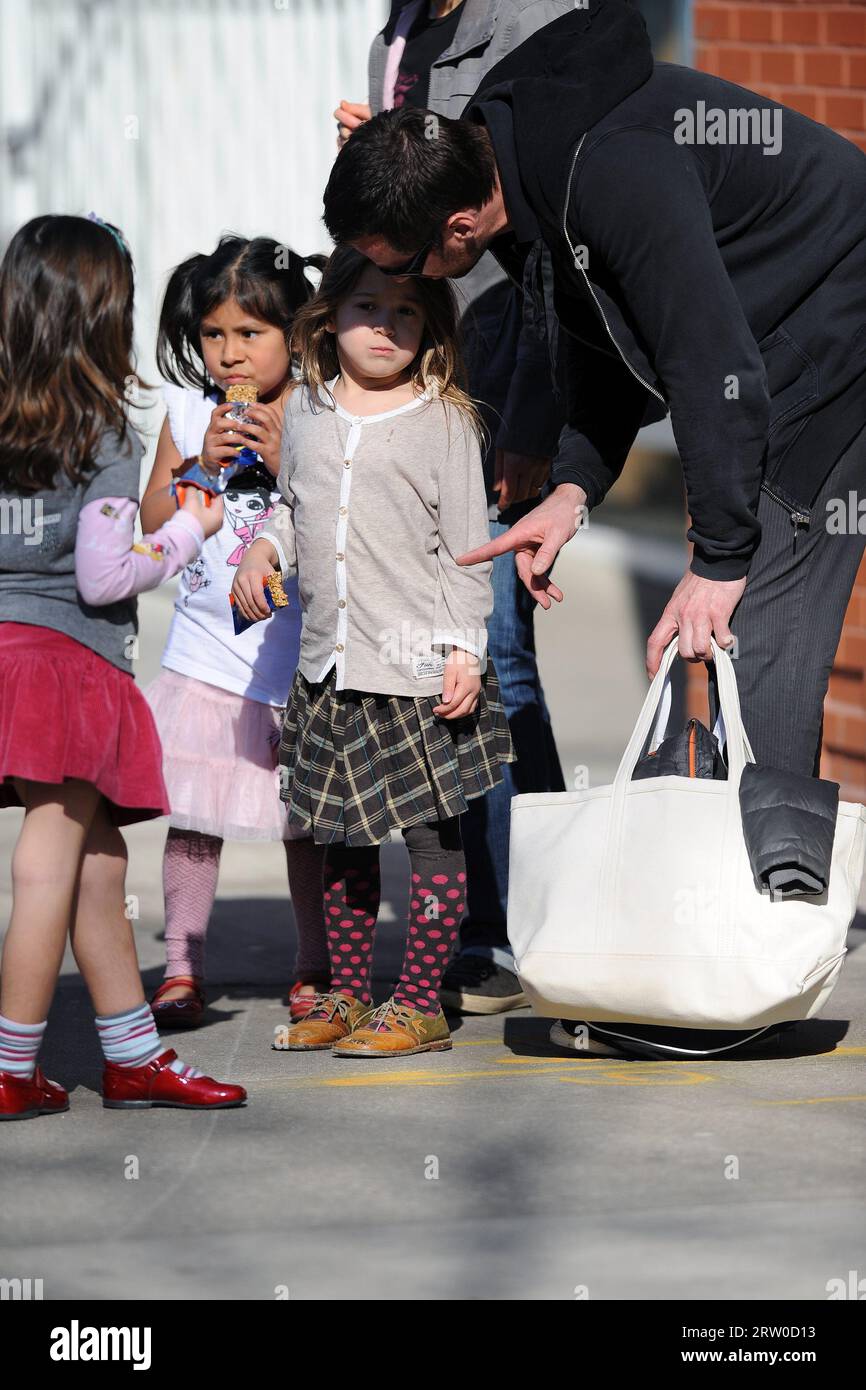 NEW YORK, NY- MARCH 9: Hugh Jackman picks up his daughter Ava (b. July ...