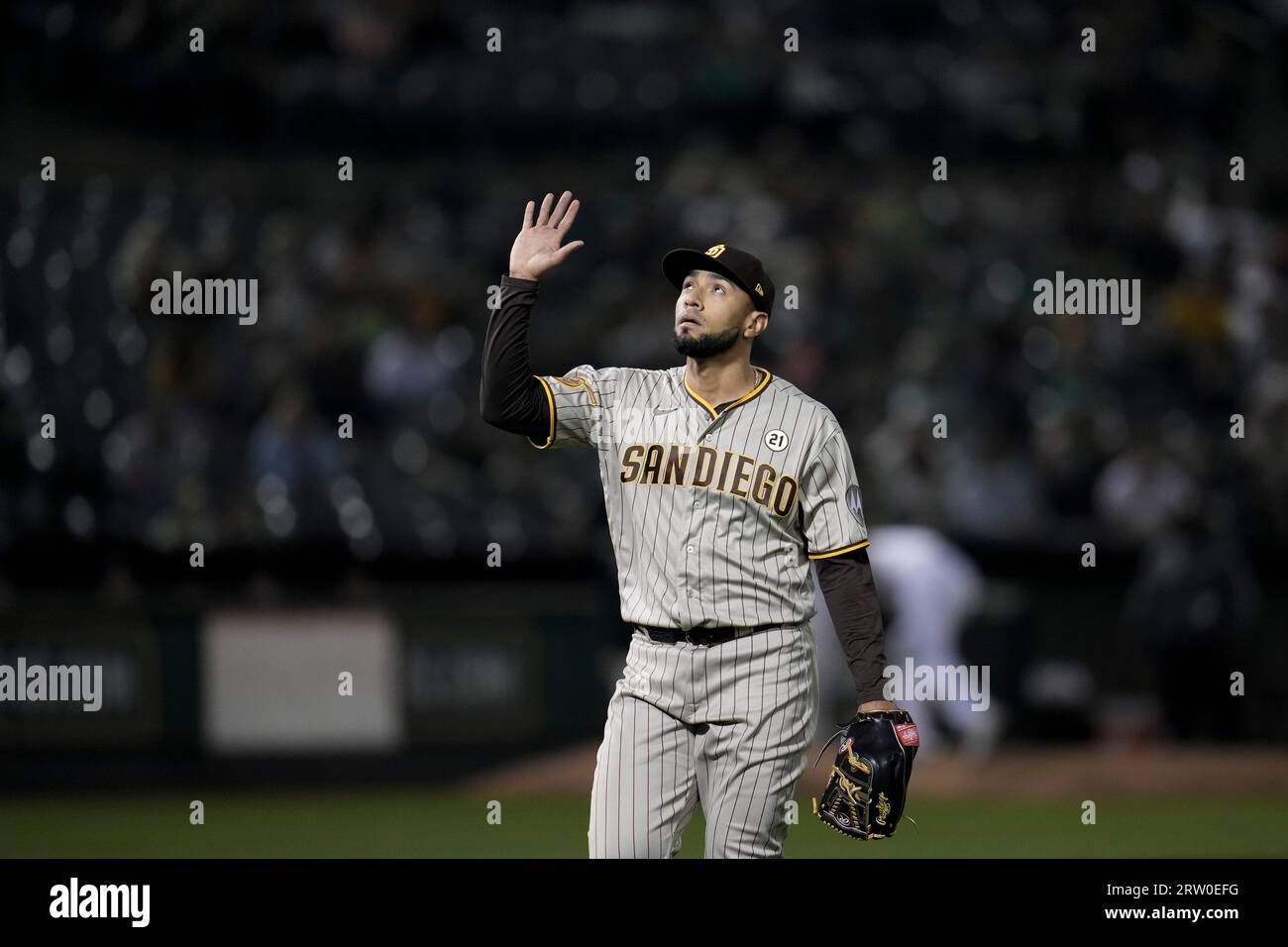 San Diego Padres pitcher Robert Suarez reacts as he walks to the dugout ...