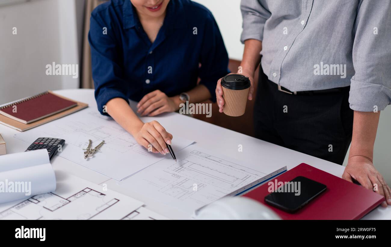 Two architects are discussion and analysis about construction of ...