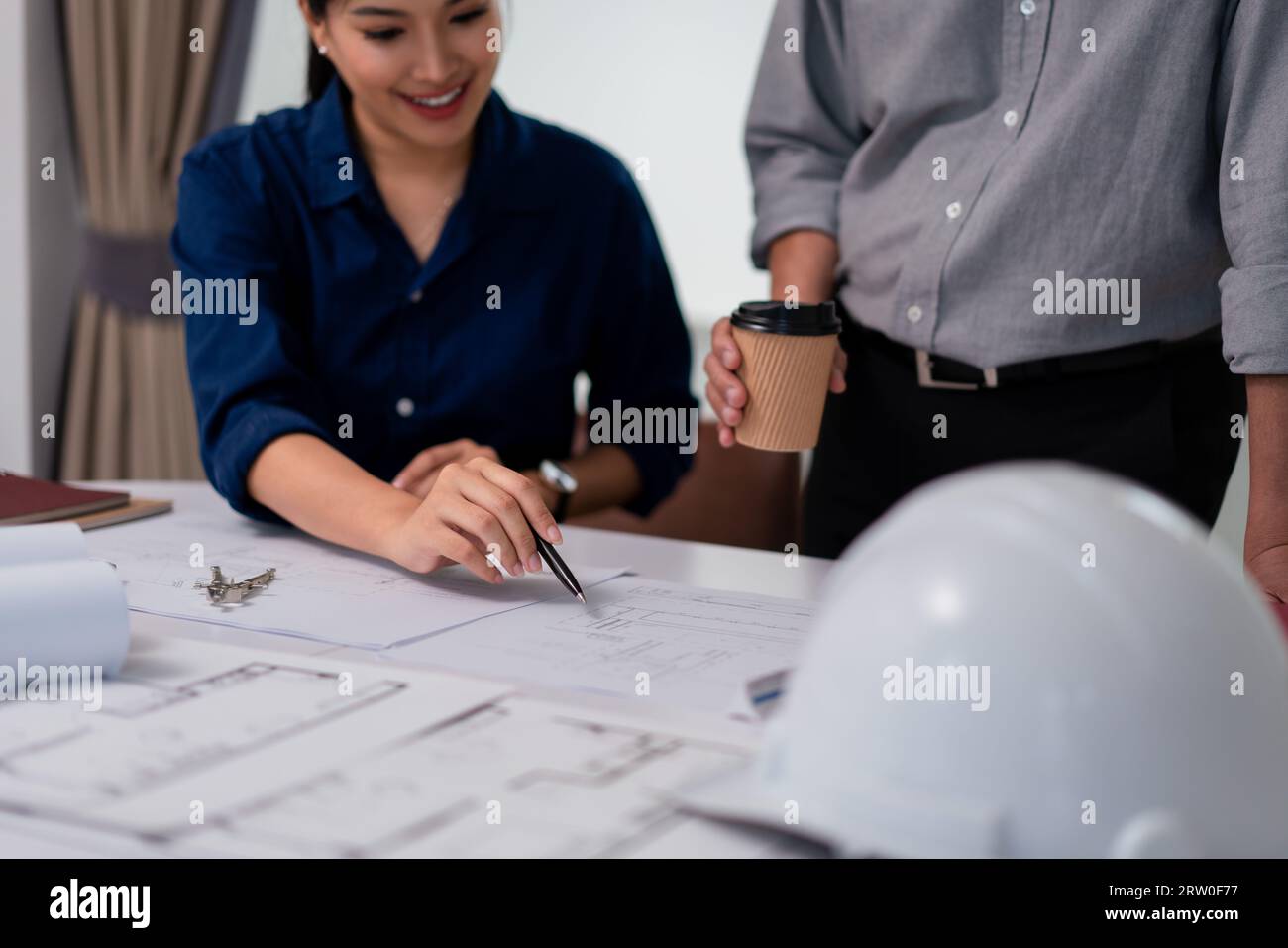 Two architects are discussion and analysis about construction of ...