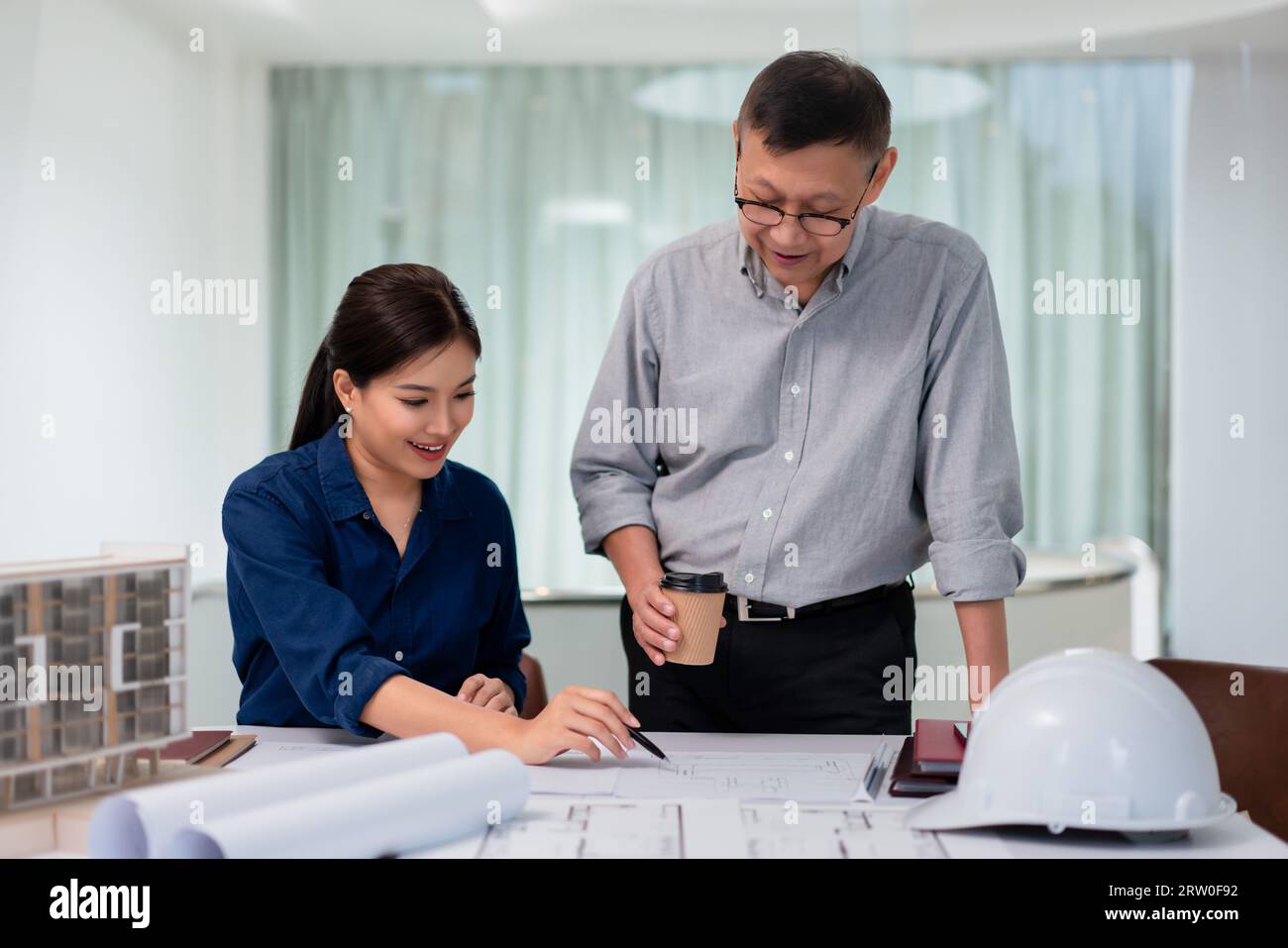 Two architects are discussion and analysis about construction of ...