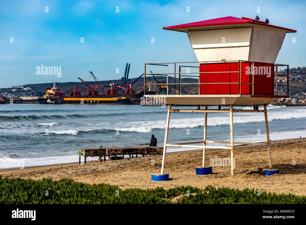 White sand beach with the watchman's hut in the city of Ensenada in the ...