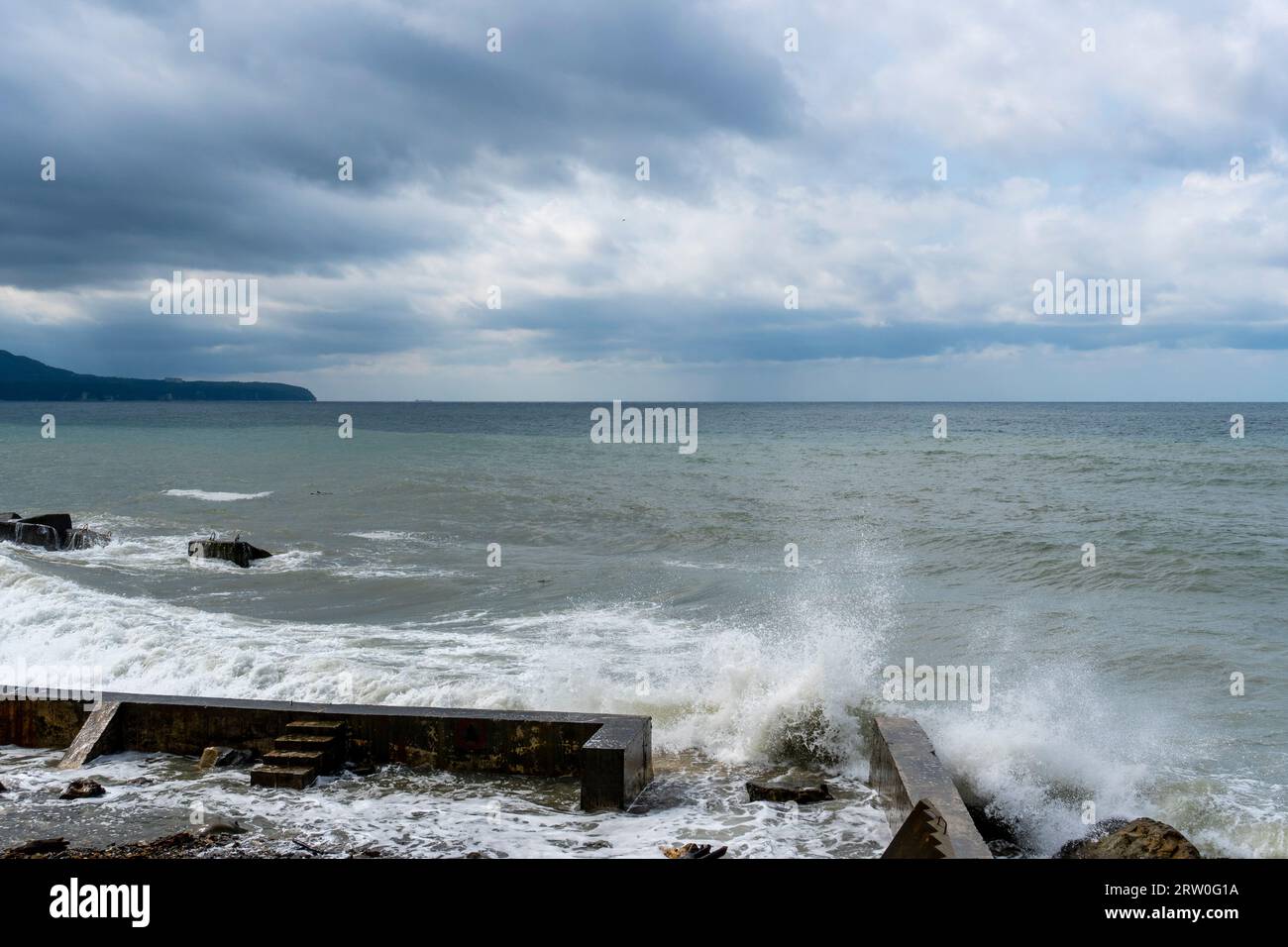 small storm on the sea, waves hitting the shore Stock Photo - Alamy
