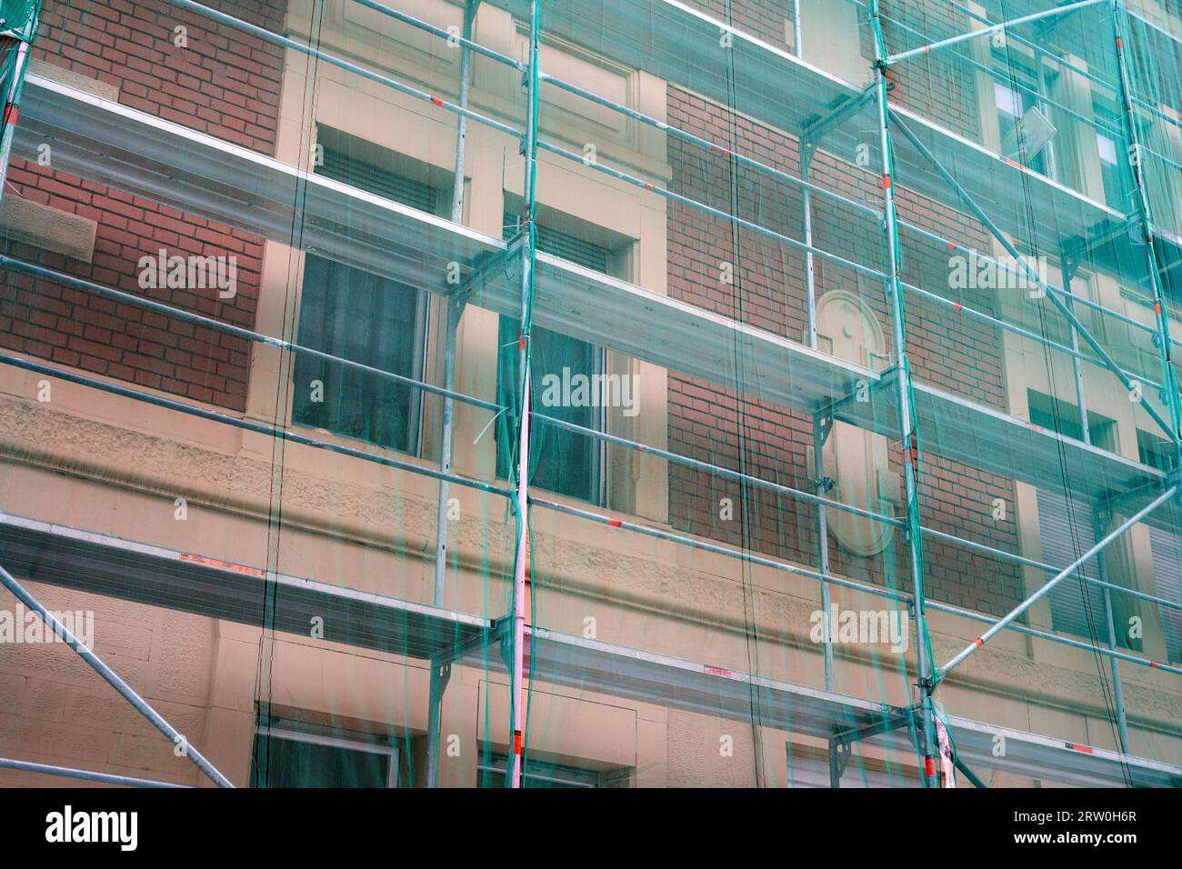 Scaffold in front of old building. Renovation of facade and windows ...