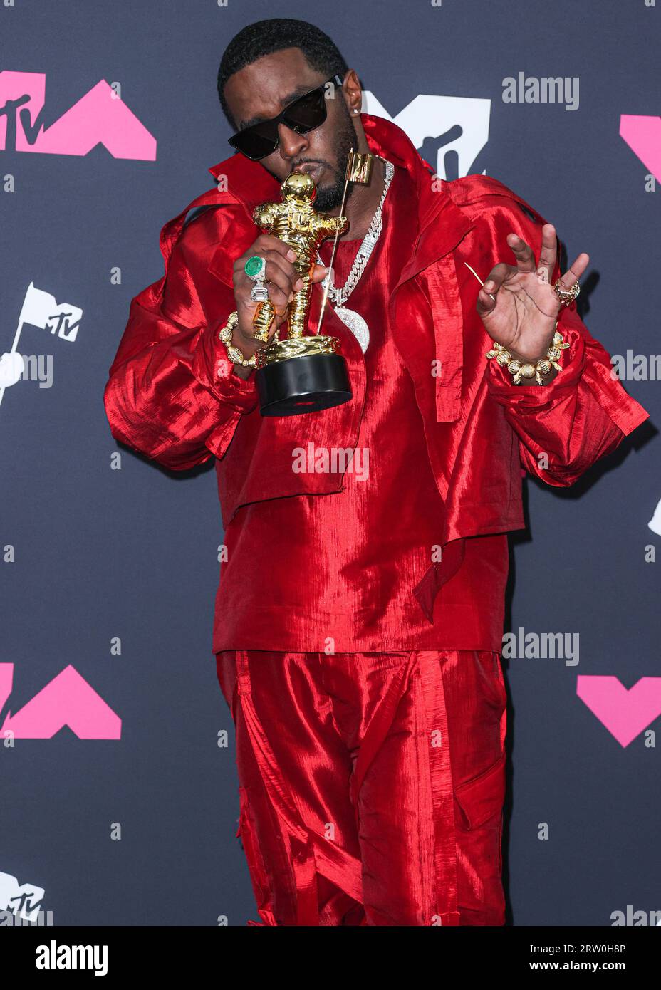 NEWARK, NEW JERSEY, USA - SEPTEMBER 12: Sean Diddy Combs poses with the 'Global Icon Award' in ...