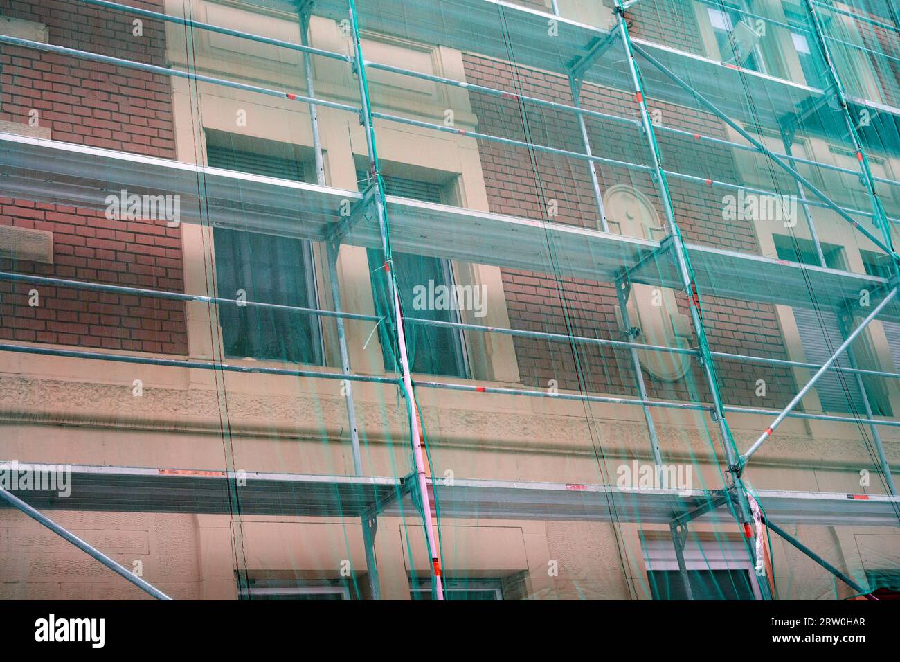 Scaffold in front of old building. Renovation of facade and windows ...