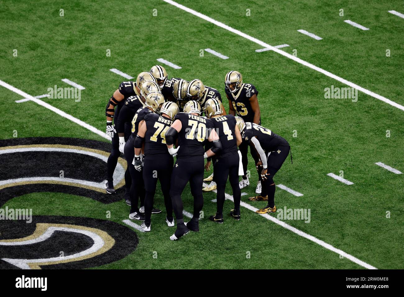 New Orleans Saints quarterback Derek Carr (4) leads a team huddle ...