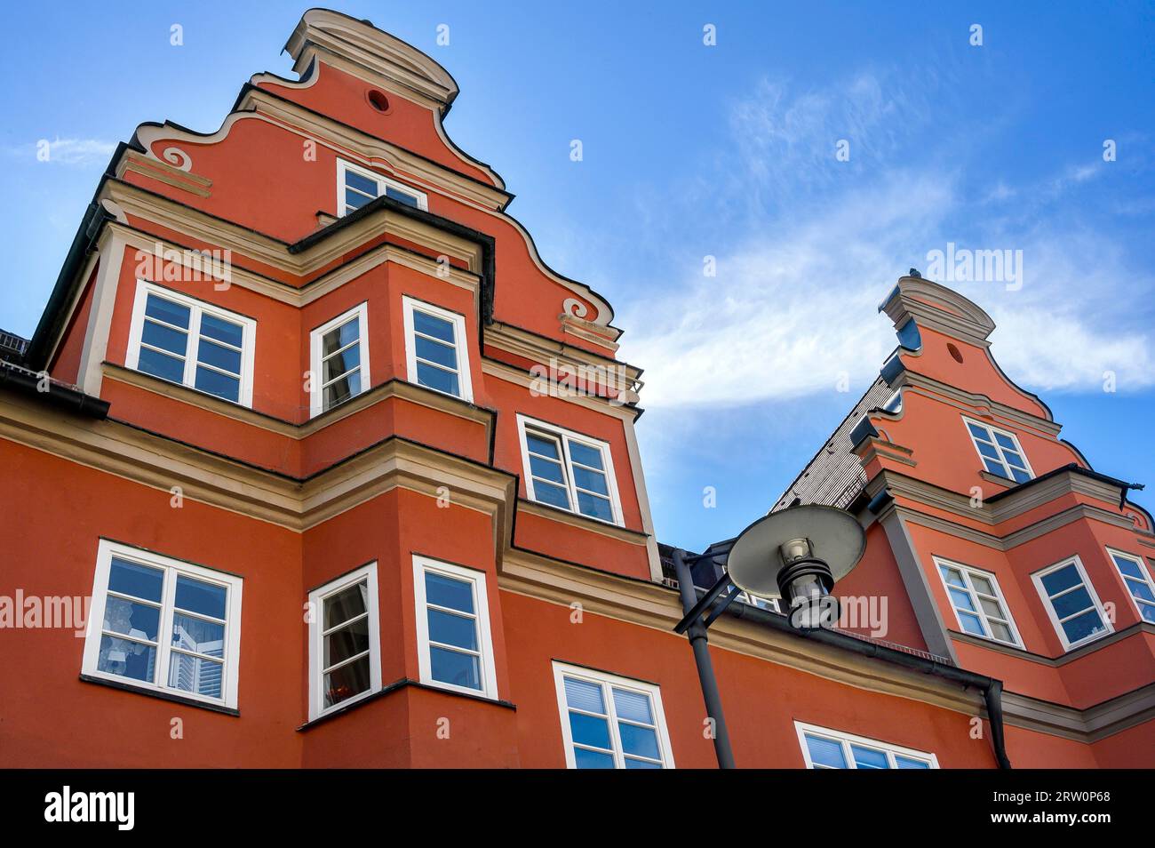 Red facade with baroque gables, restored old buildings, old town ...