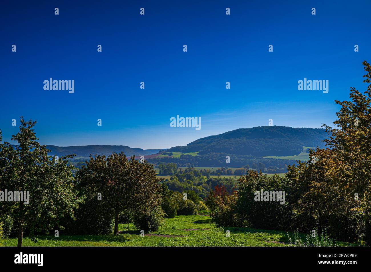 View of the core mountains of Jena in the morning under a blue sky ...