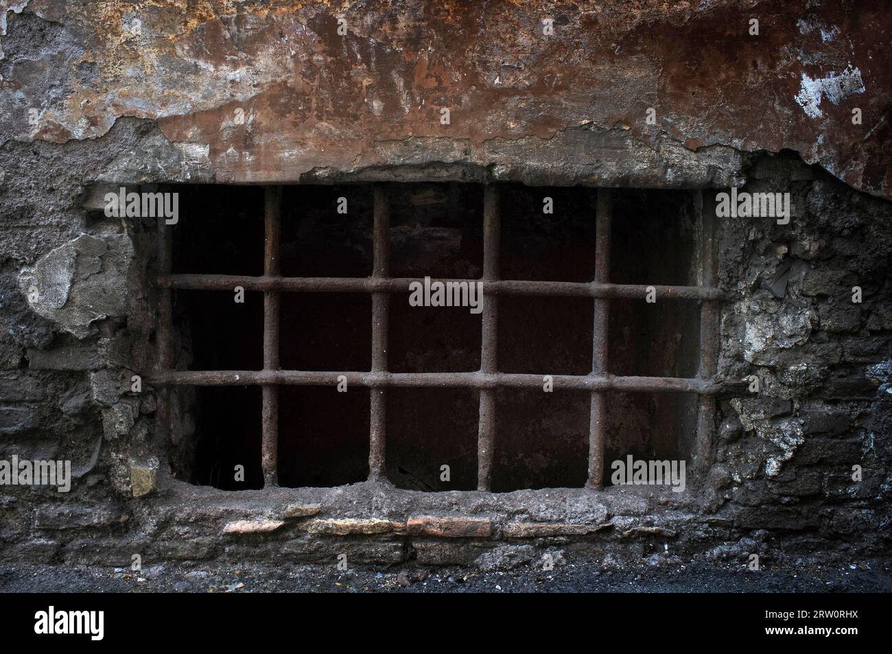 Old creepy cellar window with bars Stock Photo - Alamy