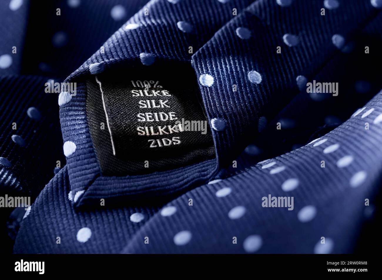Label of a tie made of silk. Short depth of field, the sharpness is in ...