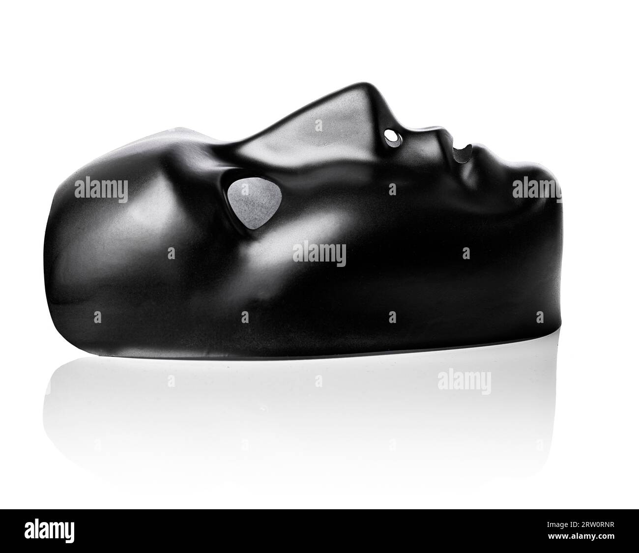 Black plastic mask isolated on white with natural reflection Stock ...