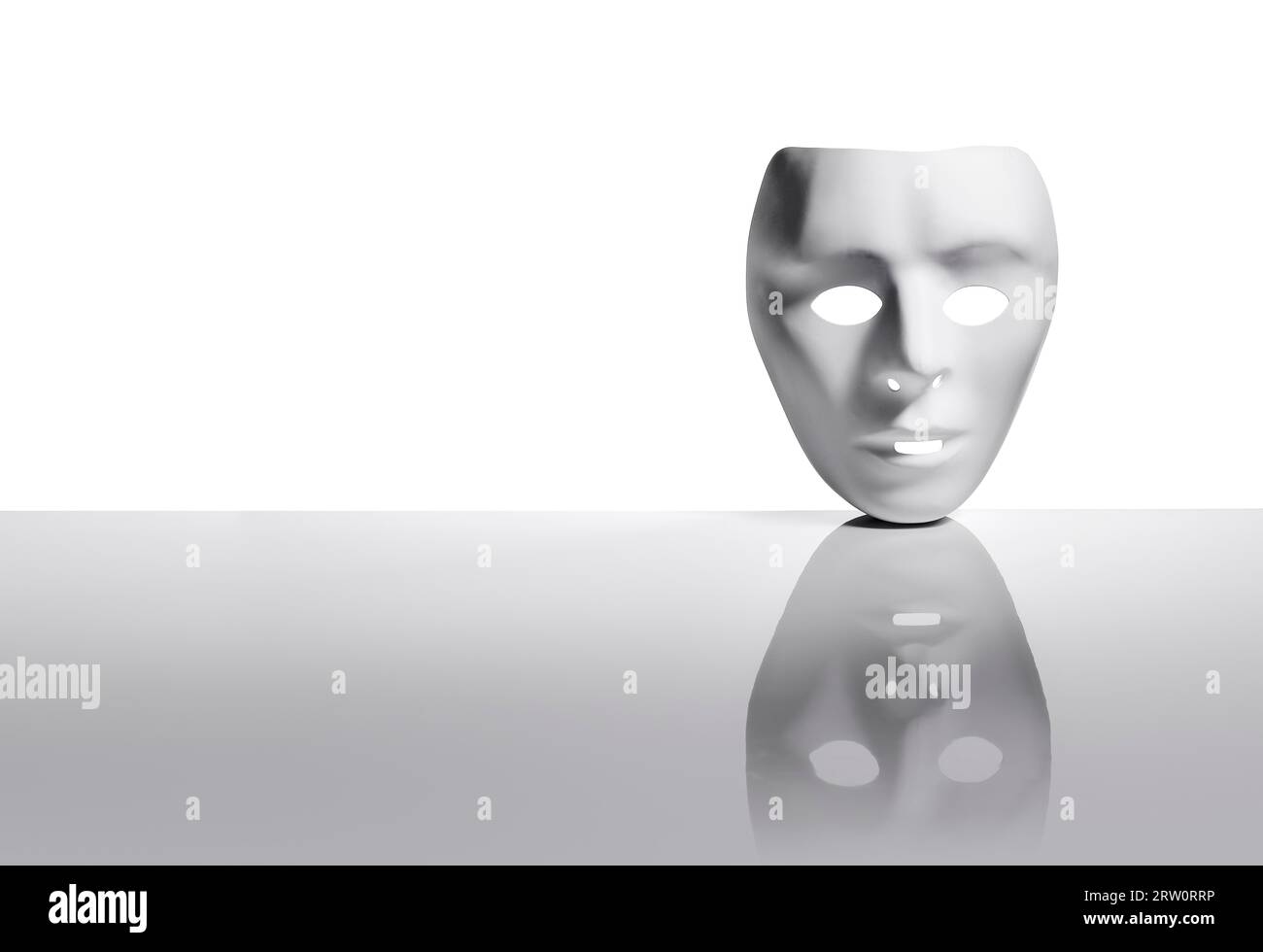 White plastic mask on reflective surface Stock Photo - Alamy