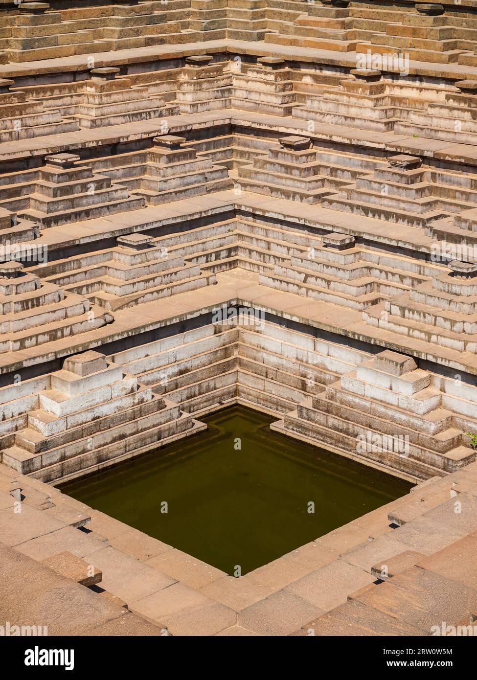 A stepped square water tank at Hampi, the centre of the Hindu ...