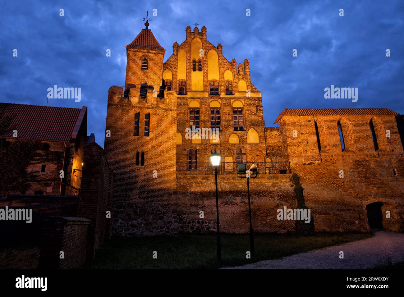 Citizen Court by night, sentry tower and city wall in Torun, Poland ...
