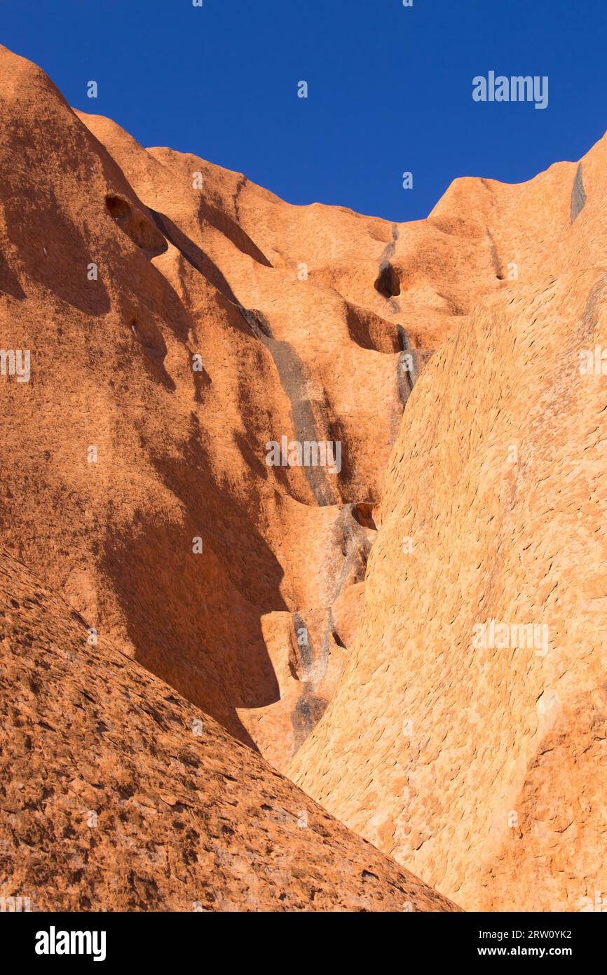 Uluru rock detail showing previous waterfalls on a clear winter#39, s ...
