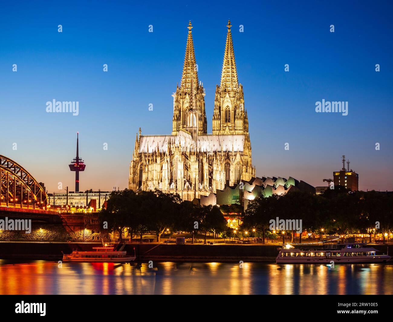 Cologne Cathedral and Hohenzollern Bridge through Rhine river in ...