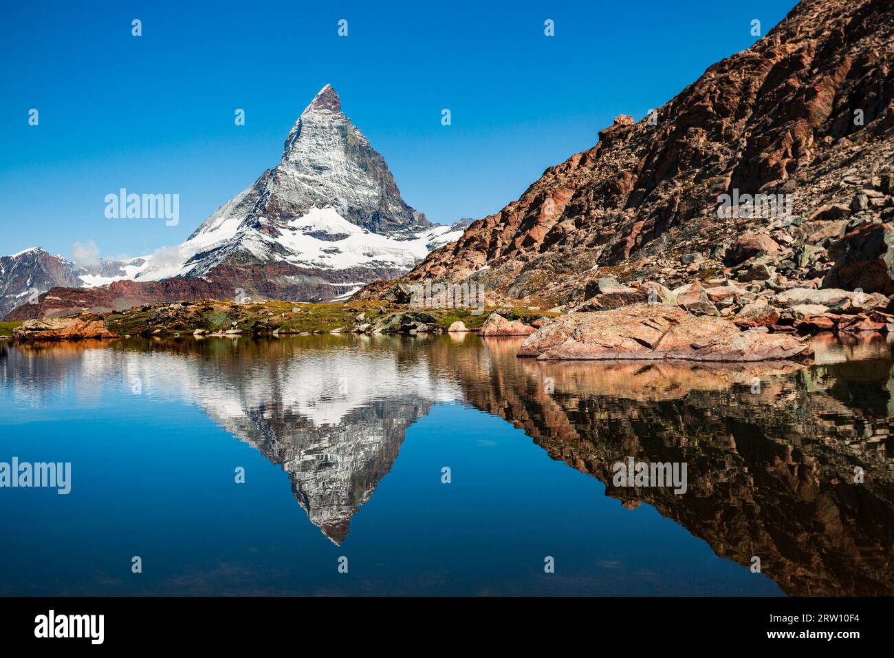 Riffelsee lake and Matterhorn mountain in the Alps, located between ...