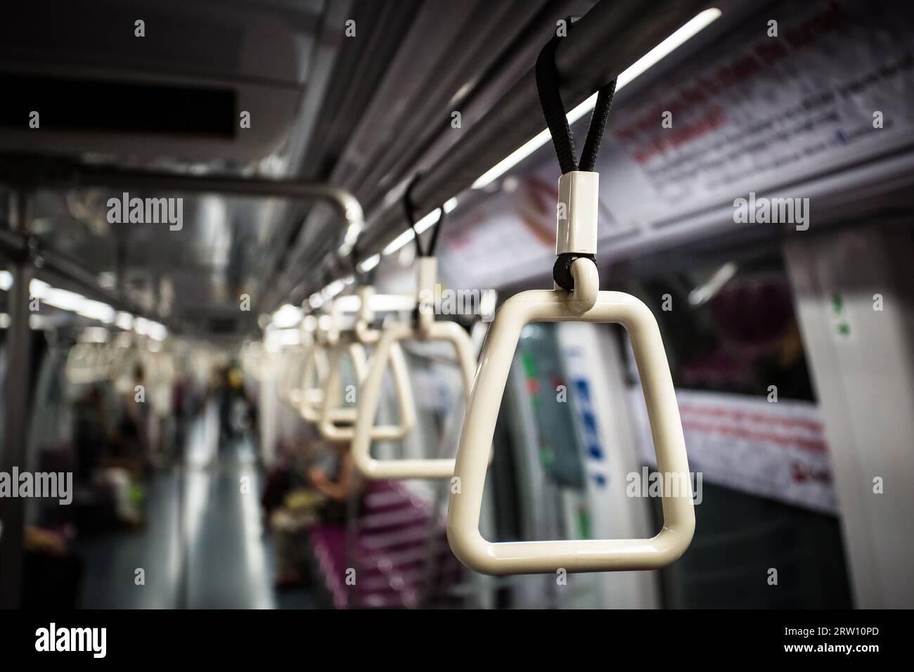 A handle for passengers in a Singaporean subway train carriage Stock ...
