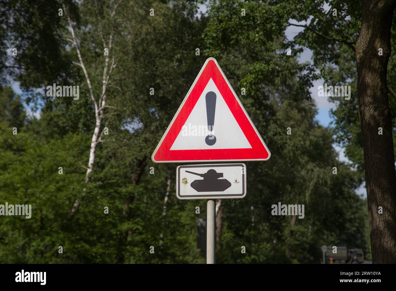 Photograph of a road sign warning for crossing tanks Stock Photo - Alamy