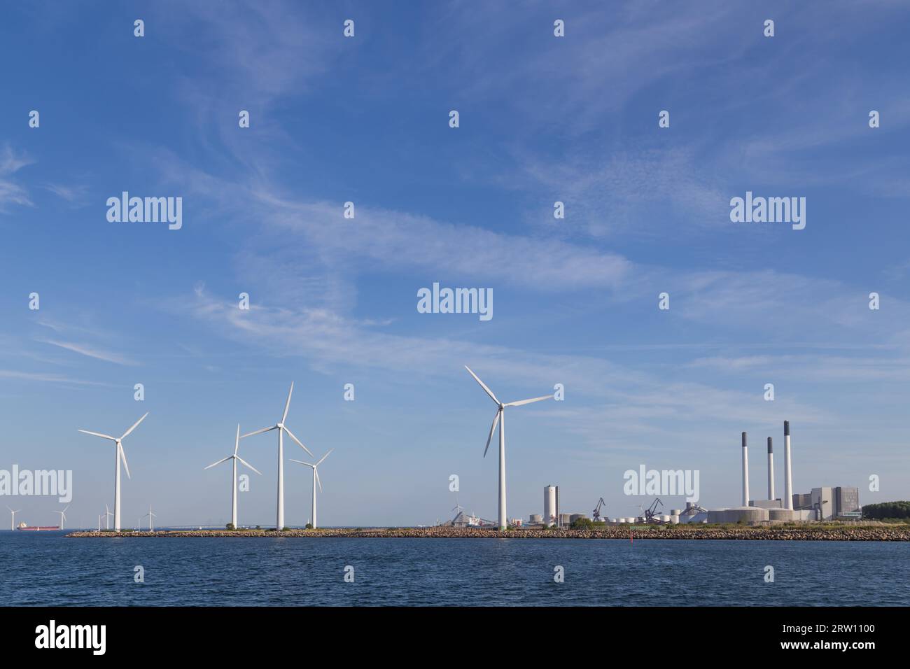 Photograph of wind power plants and industrial buildings in Copenhagen ...