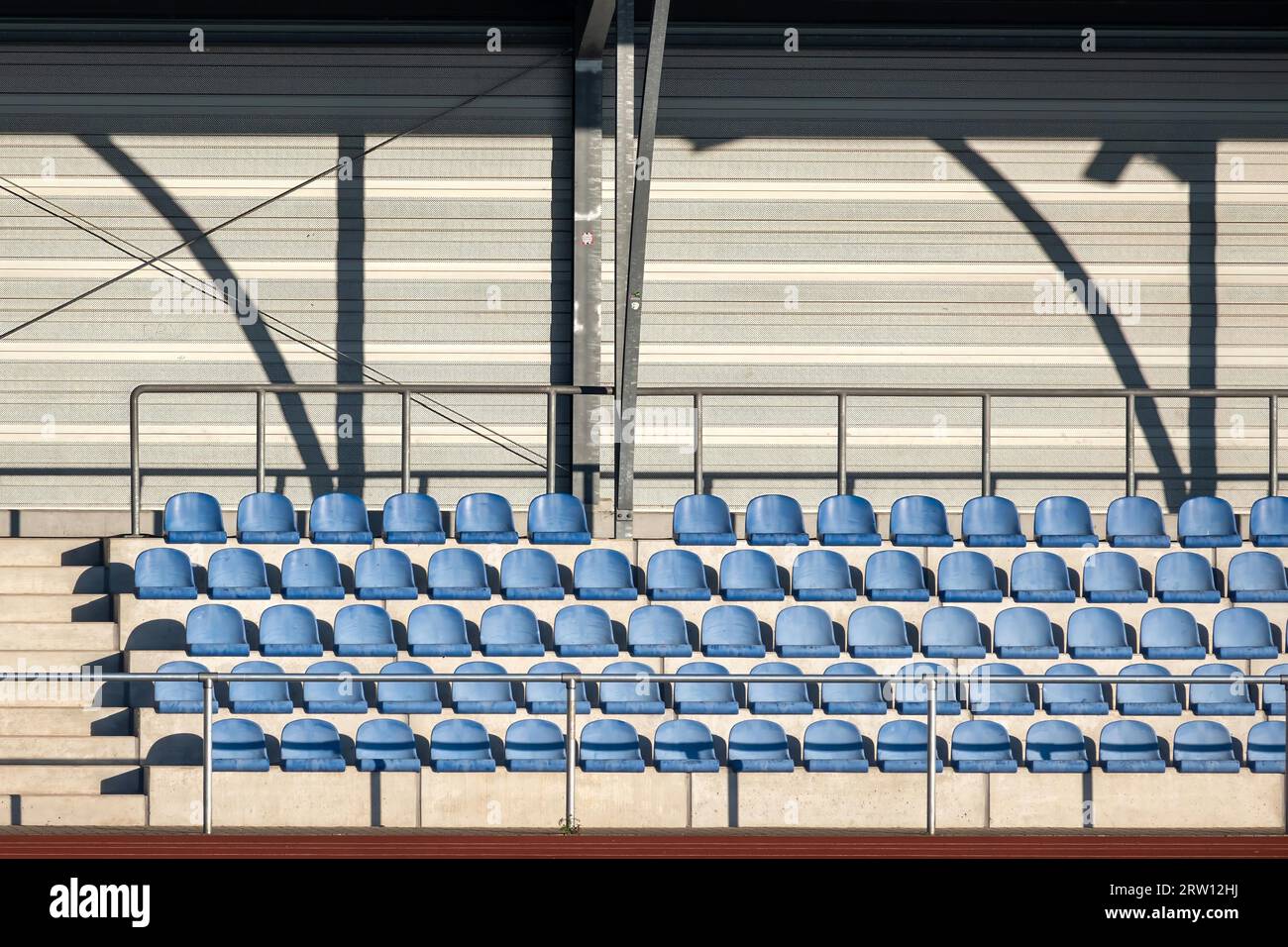 Grandstand with blue seating shells in a sports stadium Stock Photo - Alamy