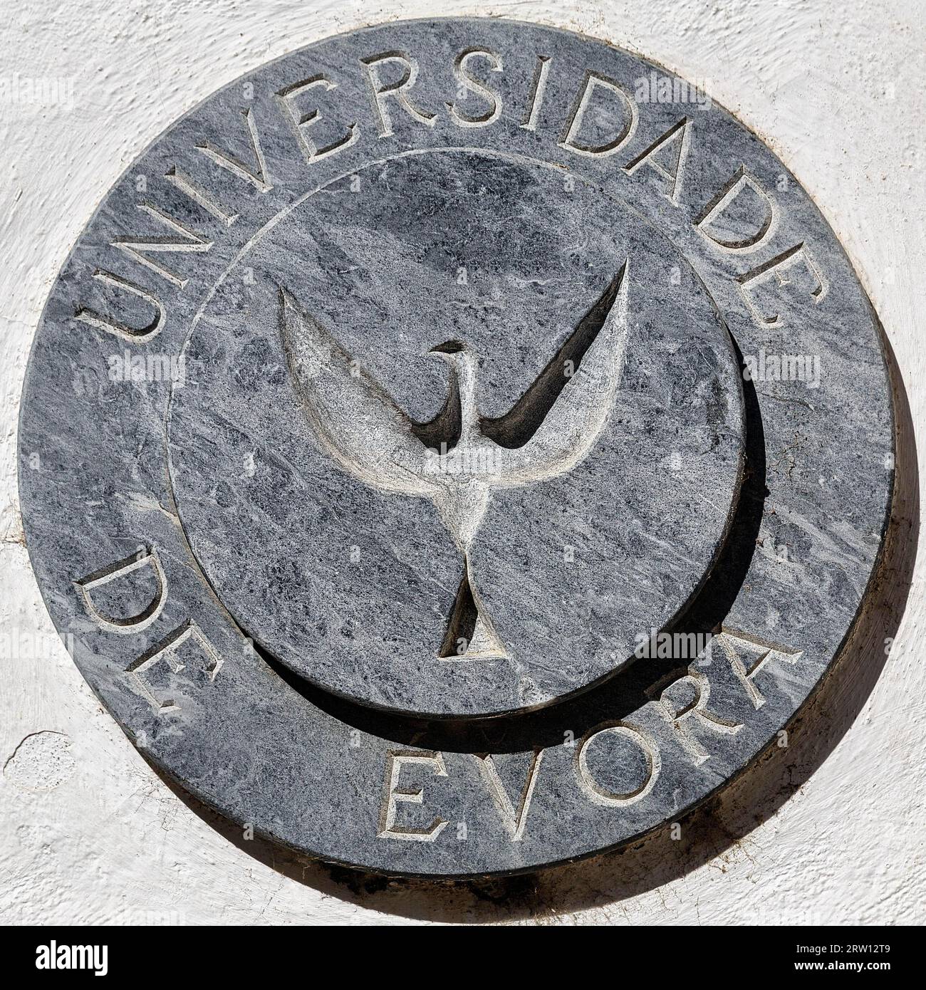 Coat of arms of the University of Evora on a house wall, Evora ...