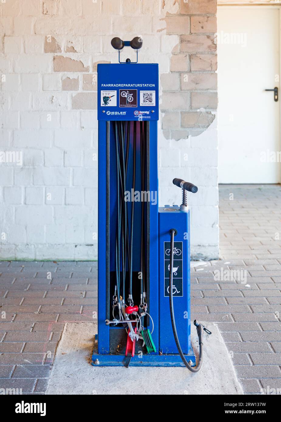 Bicycle repair station in an underground car park Stock Photo - Alamy