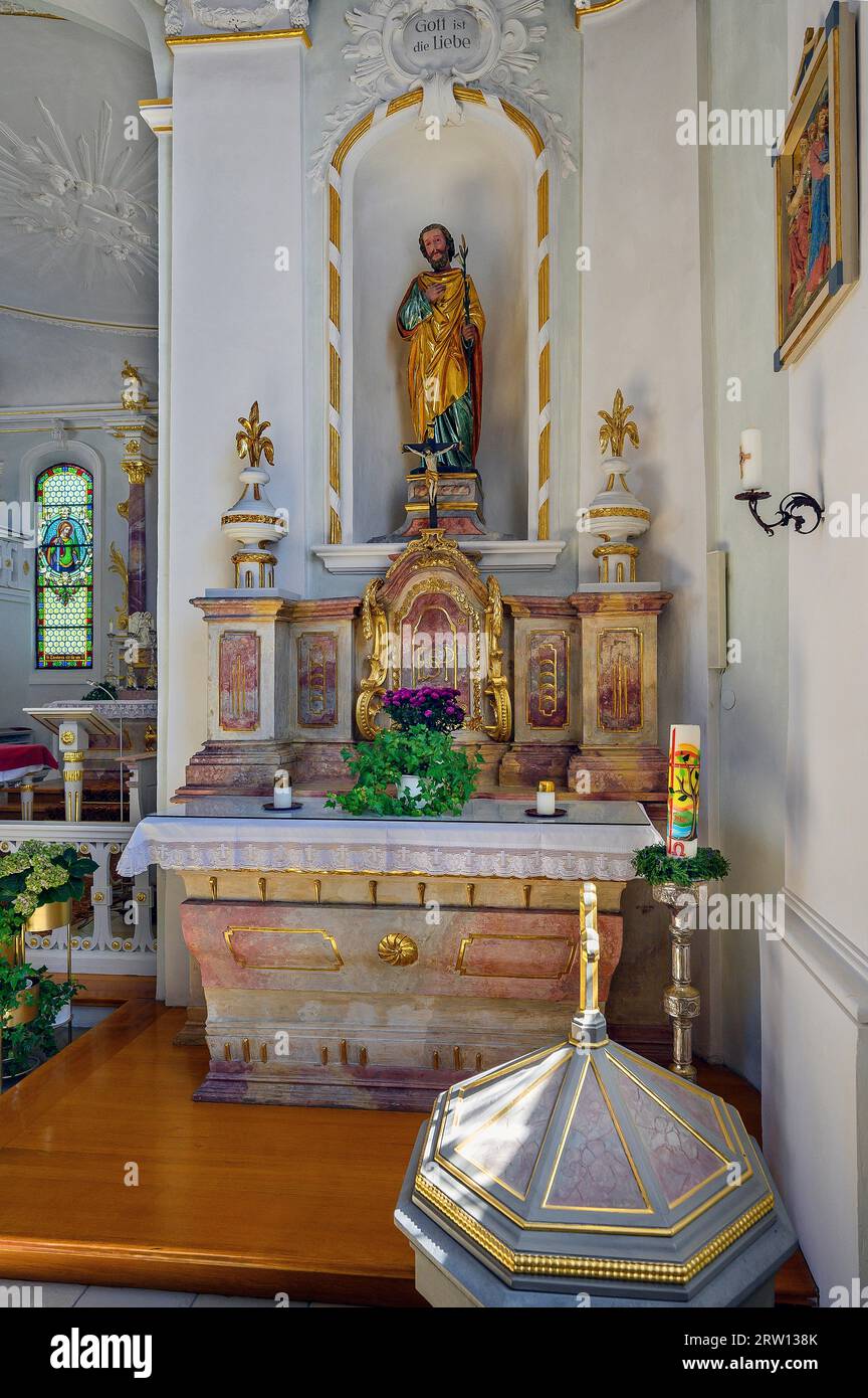 Side altar with holy figure and baptismal font, Holy Trinity Catholic ...