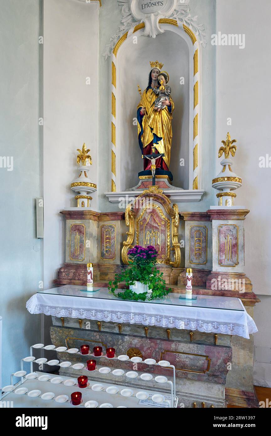 Side altar with figure of the Virgin Mary and sacrificial lanterns ...
