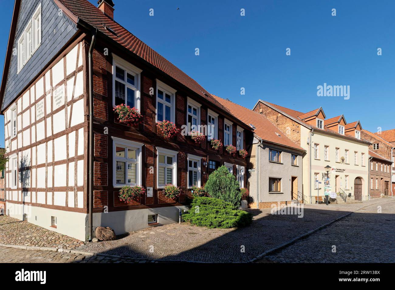 Half-timbered house decorated with flower boxes in the cobbled Lange ...