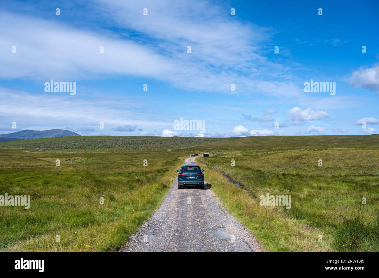 SUV on a single track road, a single lane country road in the Scottish ...