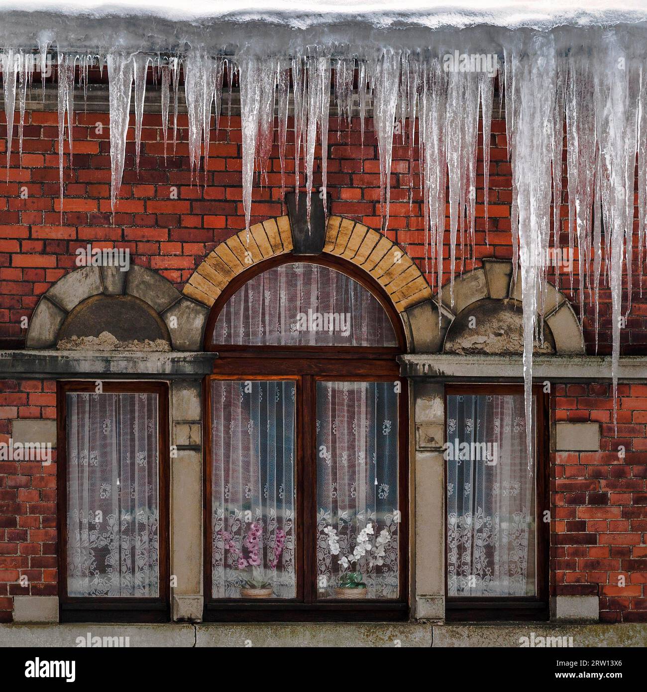 Old house with icicles Stock Photo - Alamy