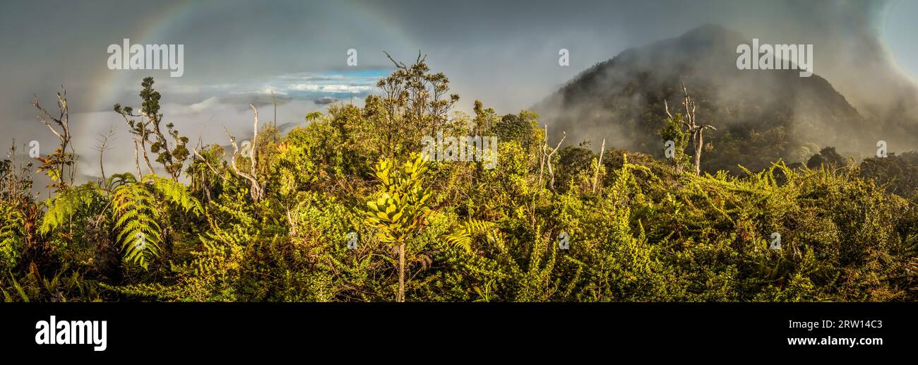 Panoramic photo of mountains covered by fog with rainbow in Digne in ...