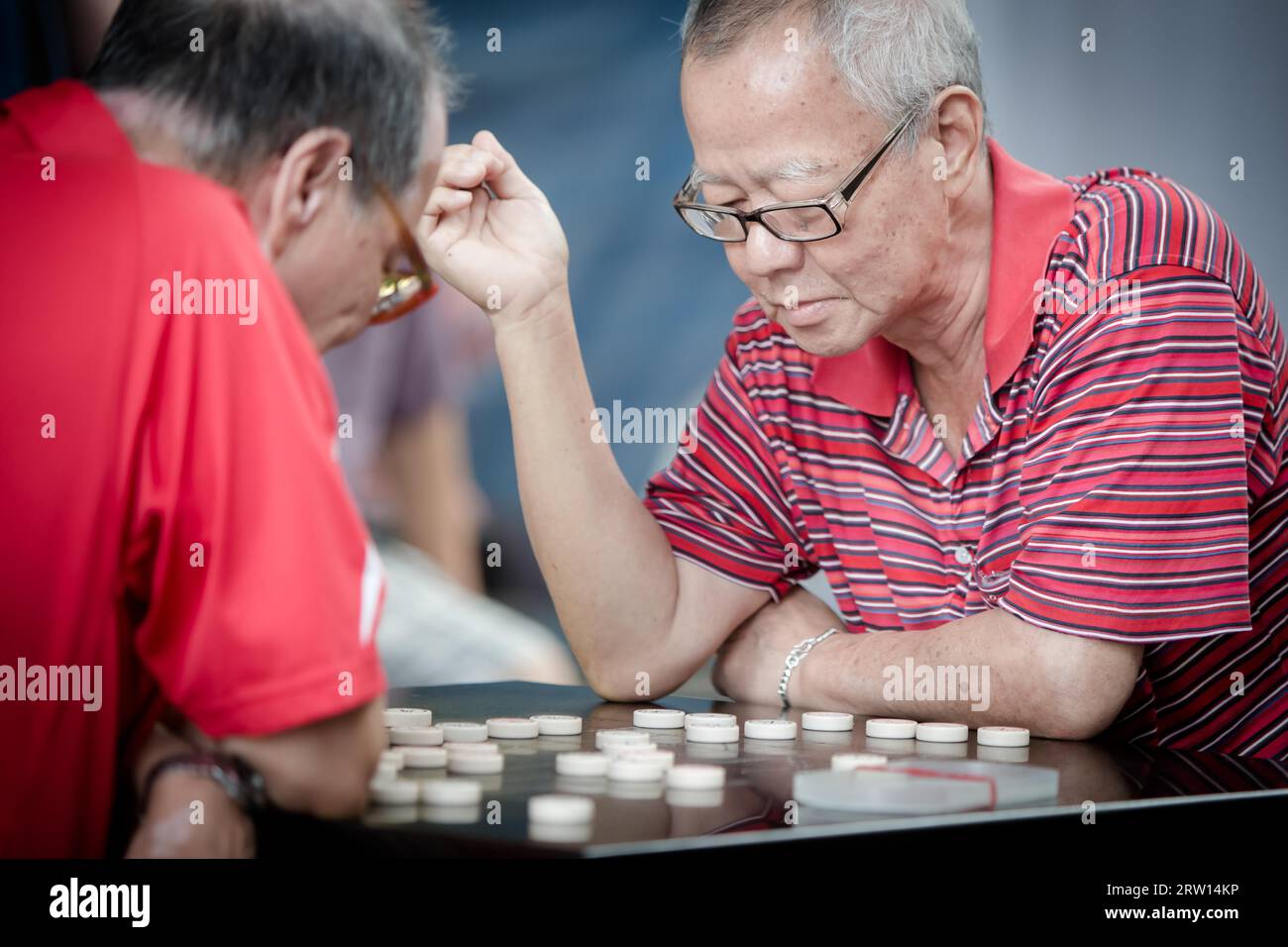 Chinatown, Singapore, June 21st 2015: Older Chinese men play Xiangqi ...