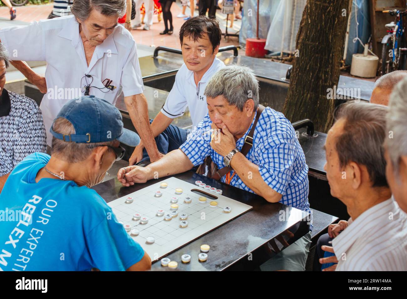 Chinatown, Singapore, June 21st 2015: Older Chinese men play Xiangqi ...