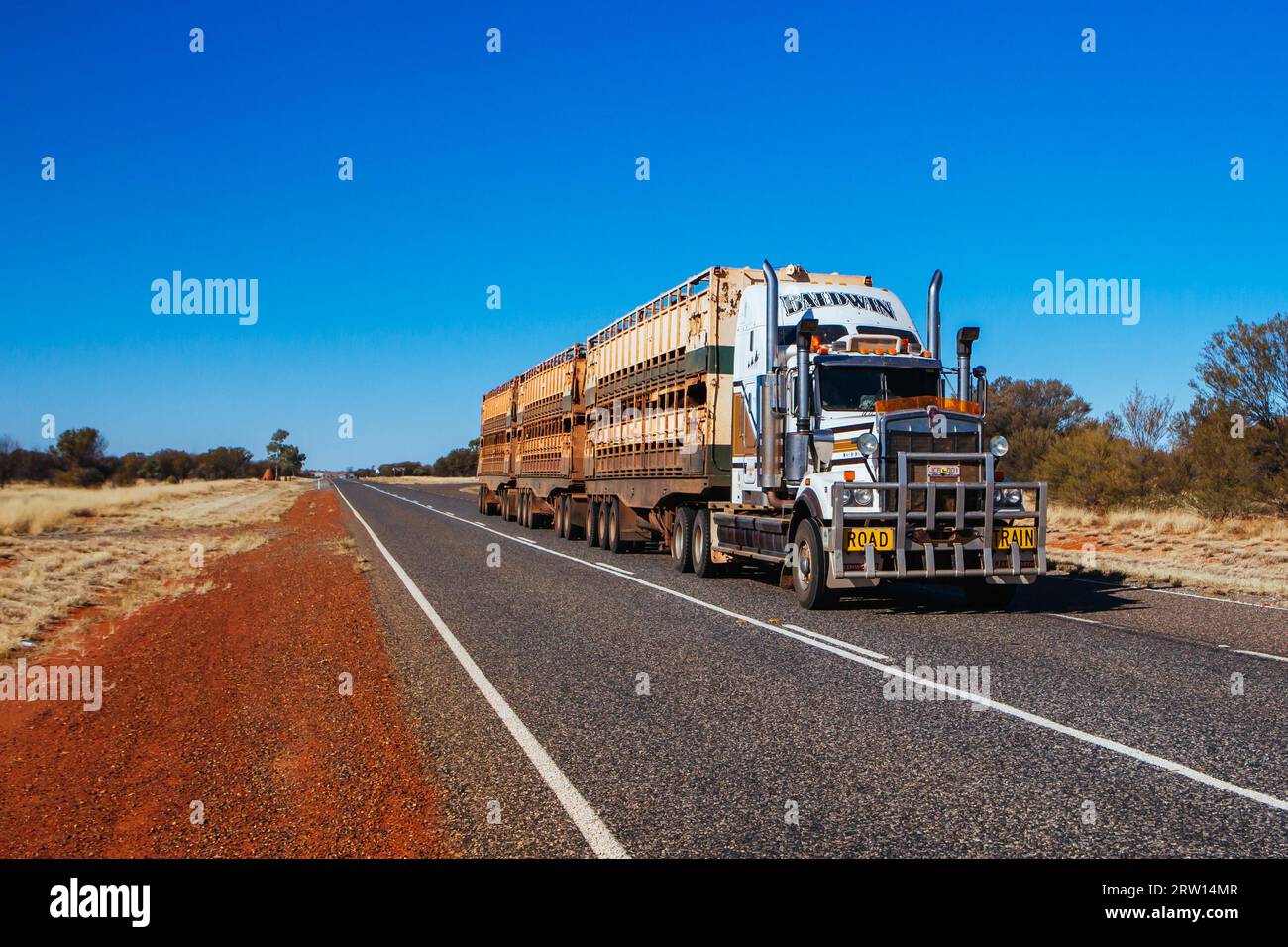 An iconic 3 trailer Australian road train travels along the Plenty Hwy ...