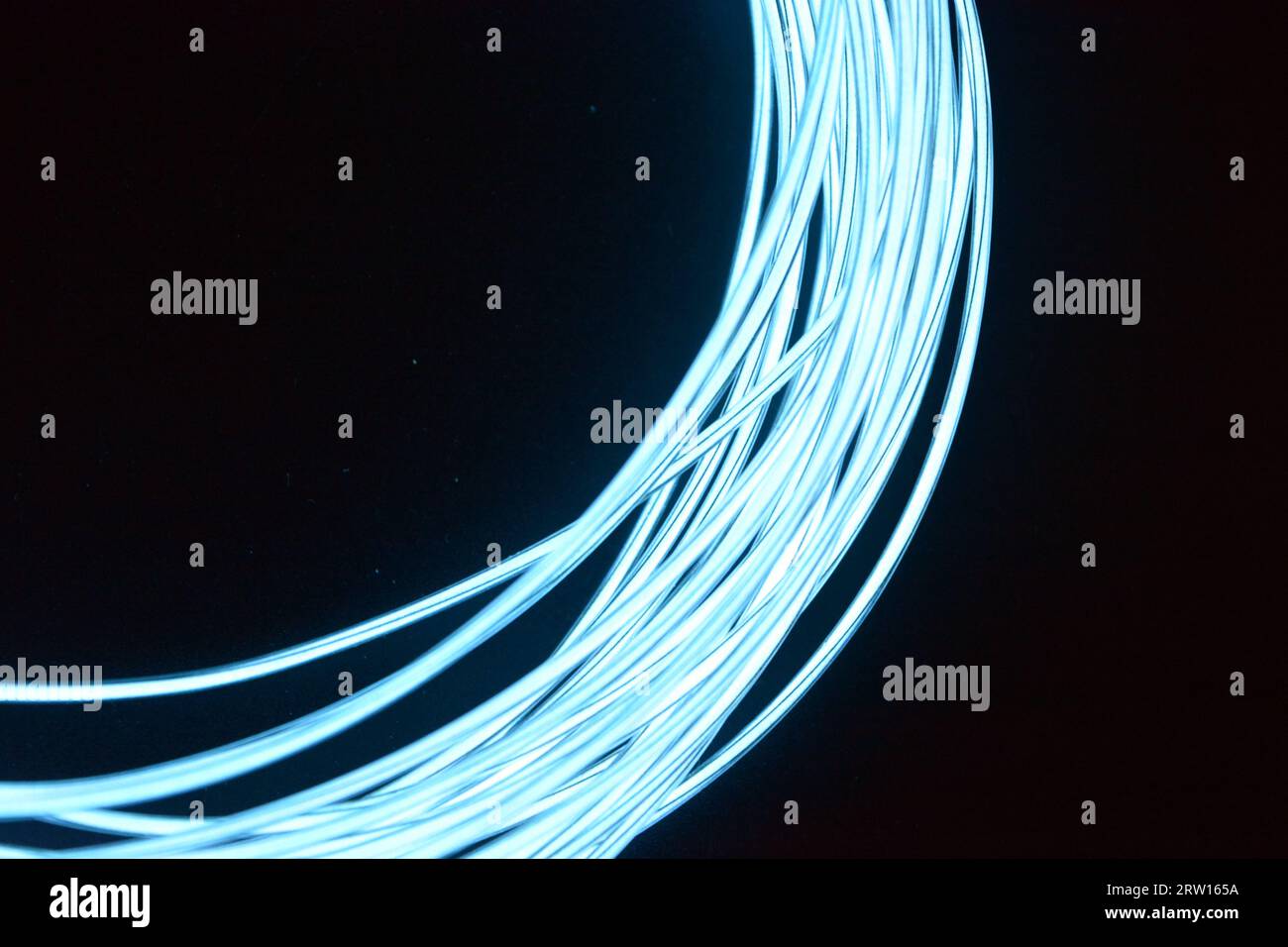 An unusual, unique glowing background of chaotically stacked thin wires ...