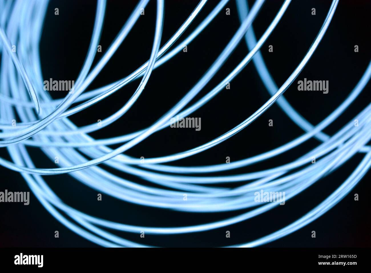 An unusual, unique glowing background of chaotically stacked thin wires ...