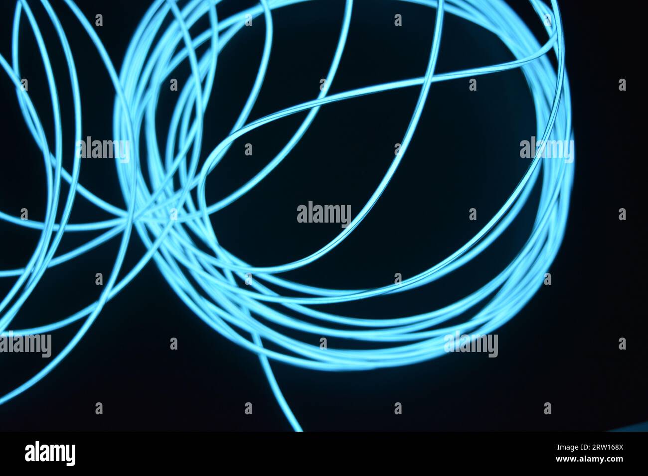 An unusual, unique glowing background of chaotically stacked thin wires ...