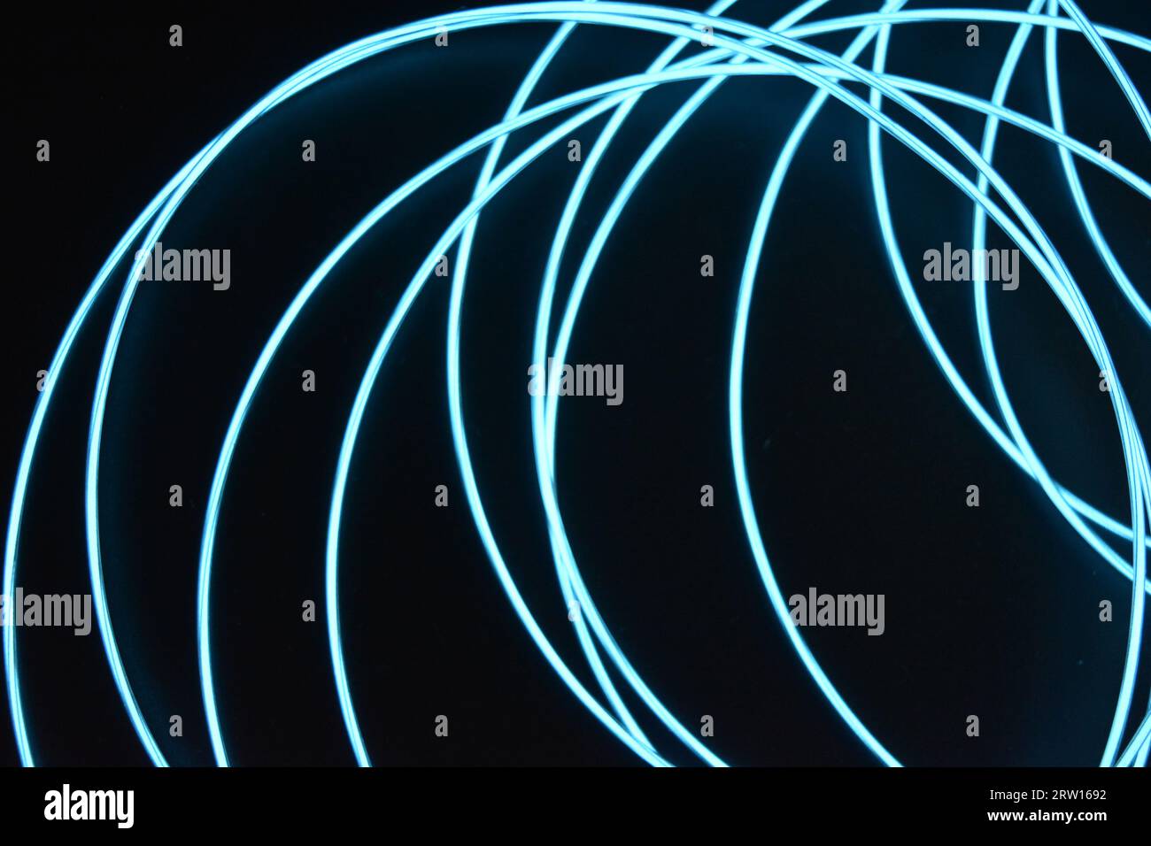 An unusual, unique glowing background of chaotically stacked thin wires ...