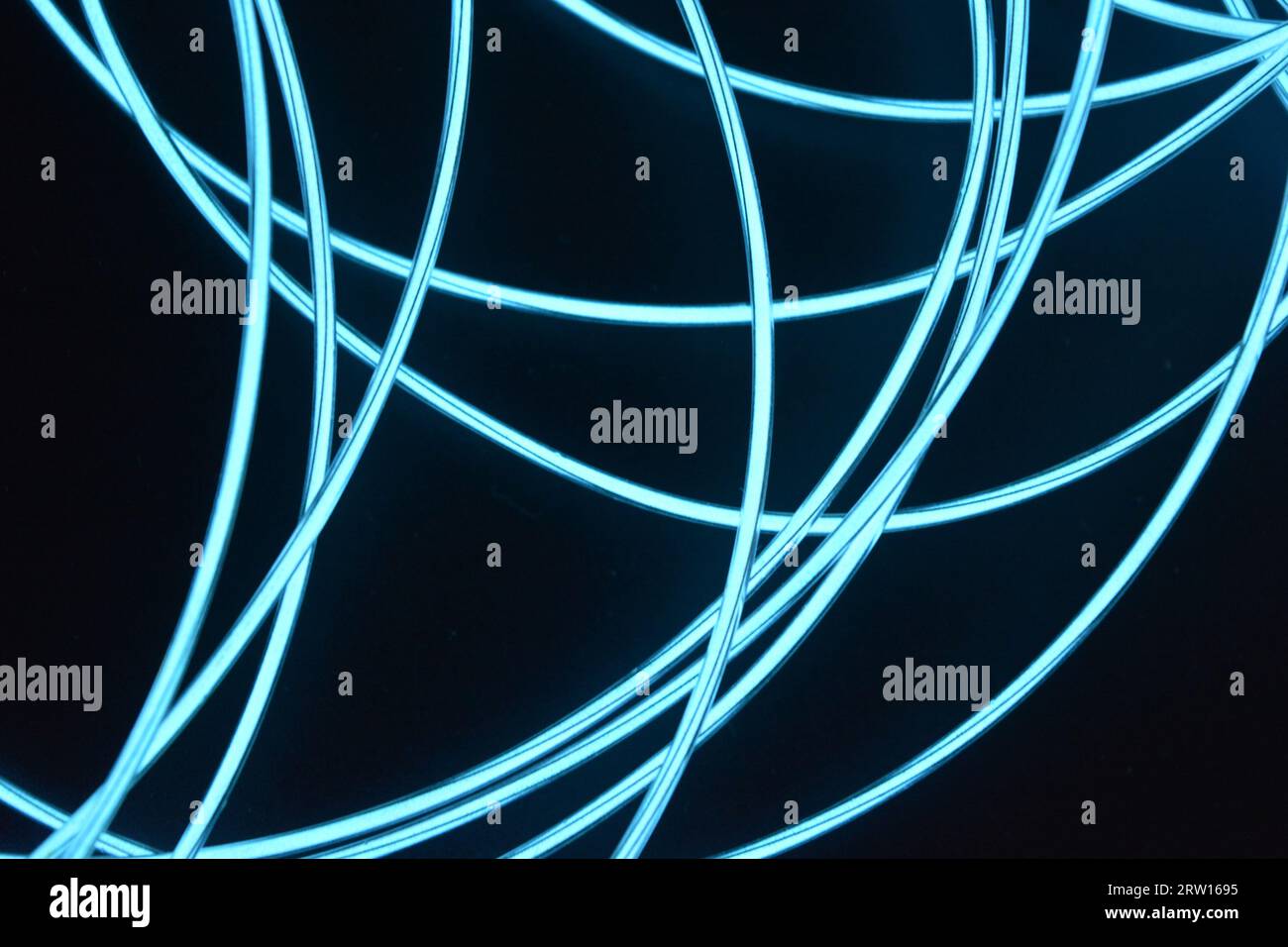 An unusual, unique glowing background of chaotically stacked thin wires ...