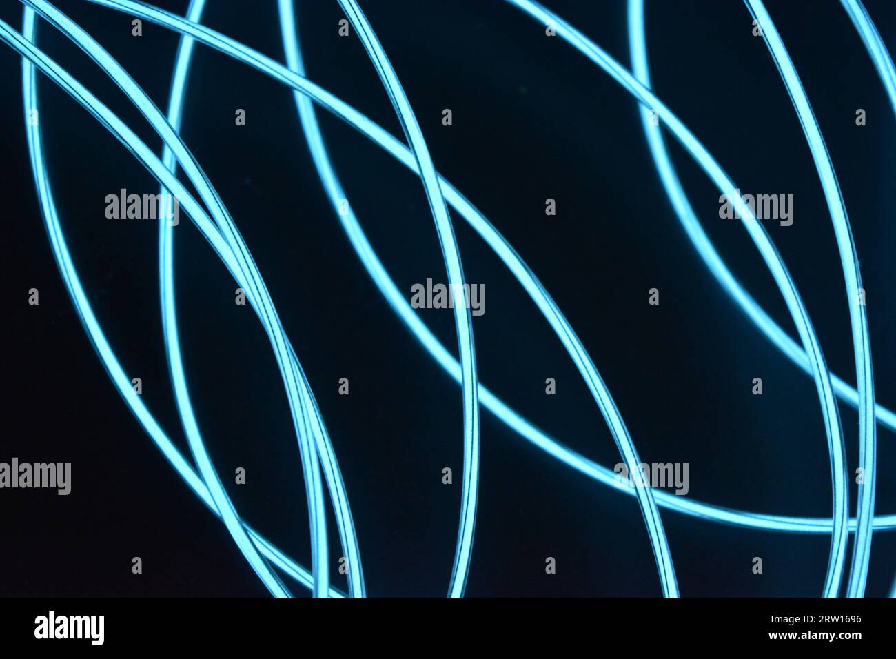 An unusual, unique glowing background of chaotically stacked thin wires ...