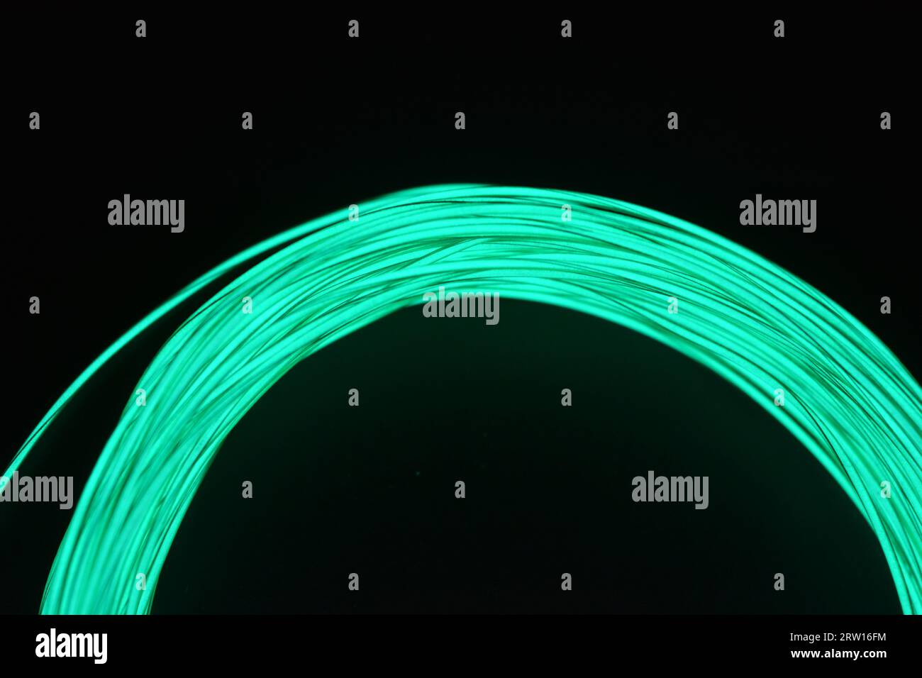 A glowing chaos of thin light wires. An unusual, unique glowing ...