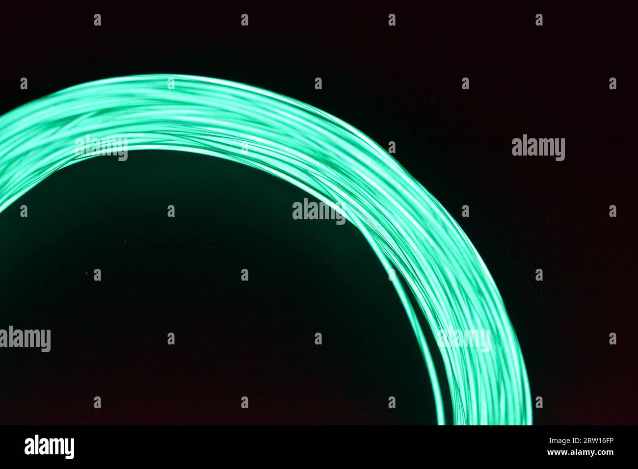 A glowing chaos of thin light wires. An unusual, unique glowing ...
