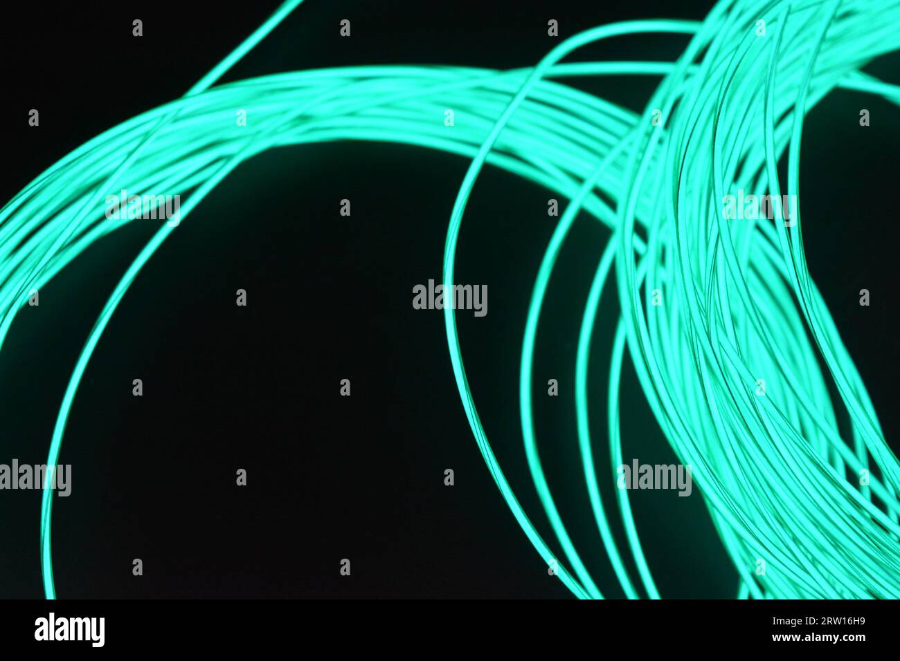 A glowing chaos of thin light wires. An unusual, unique glowing ...