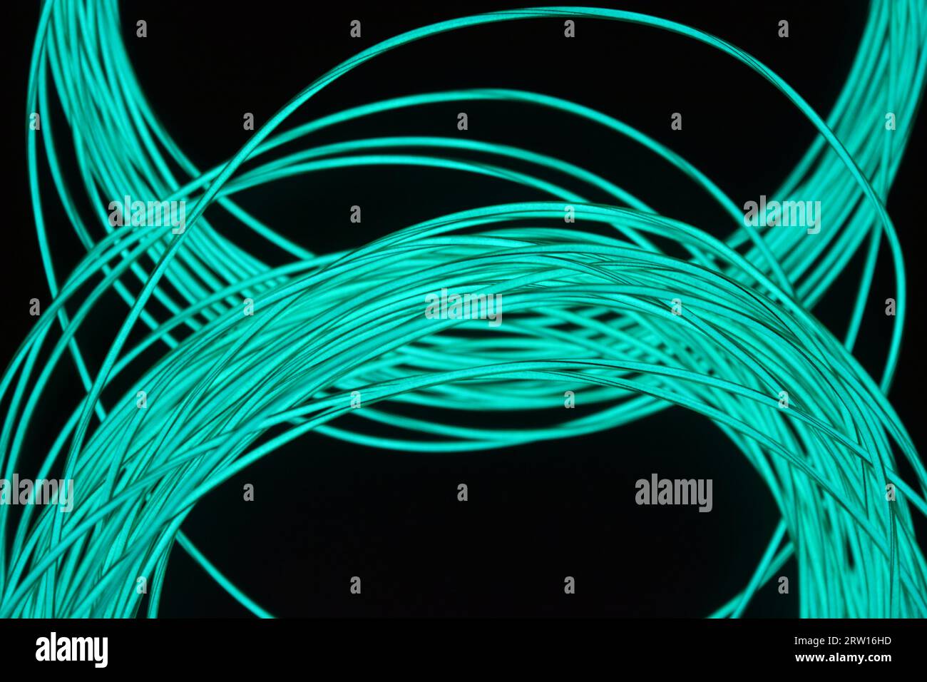A glowing chaos of thin light wires. An unusual, unique glowing ...
