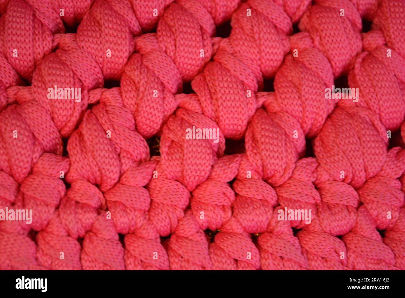 Braided background made of crimson, pink, dense thread. Beautiful ...