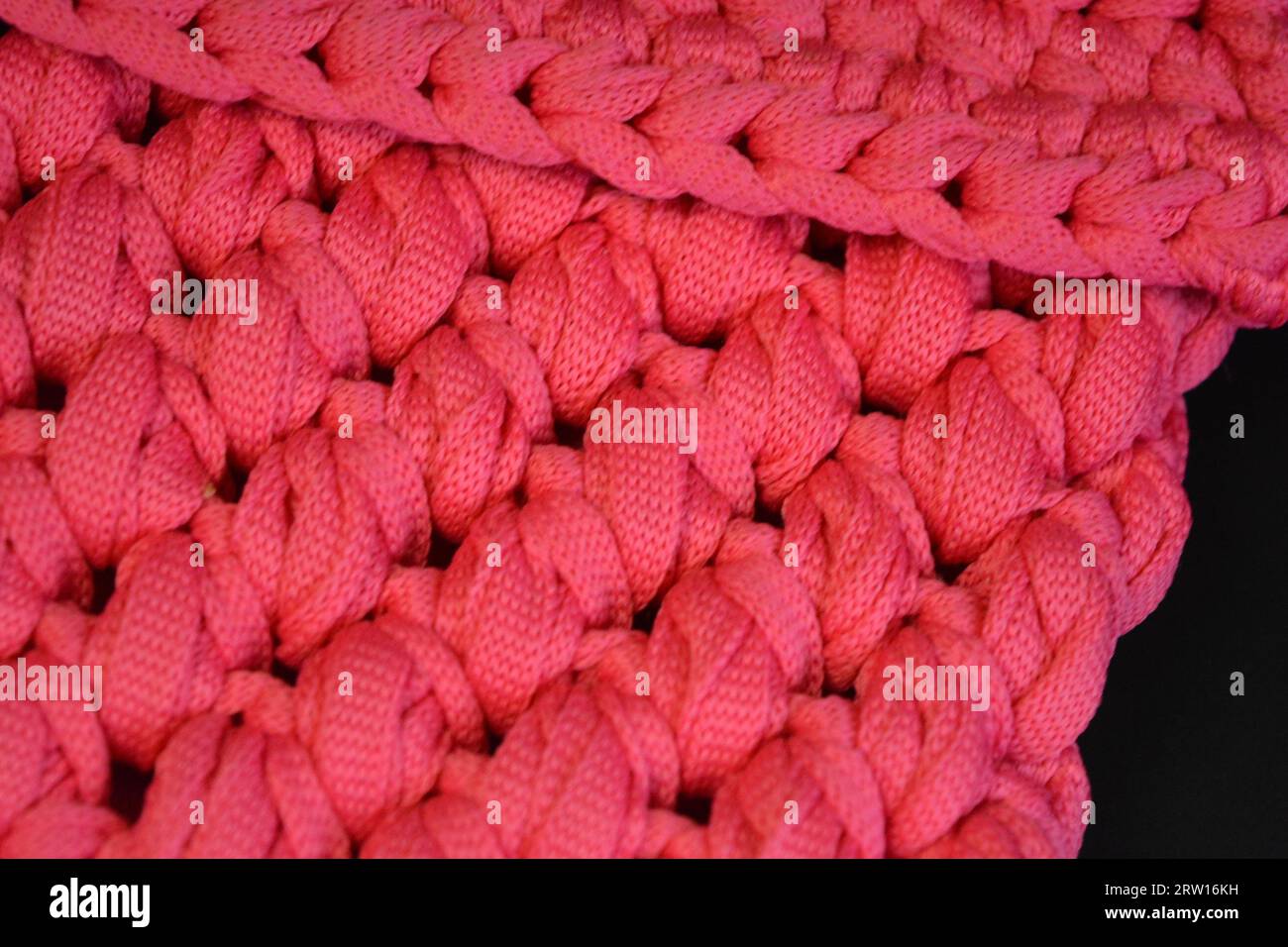 Braided background made of crimson, pink, dense thread. Beautiful ...
